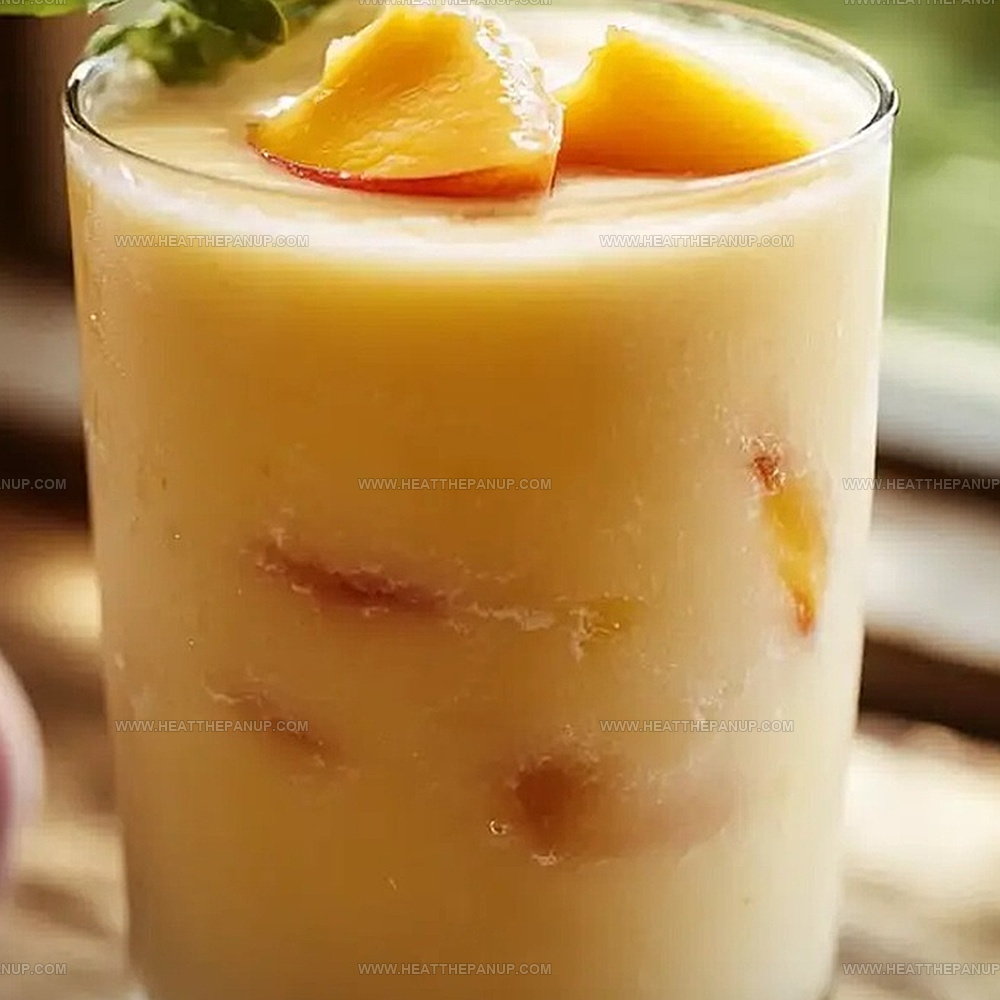 Sunshine in a Glass: Refreshing Iced Peach Colada Recipe - Heat The Pan Up